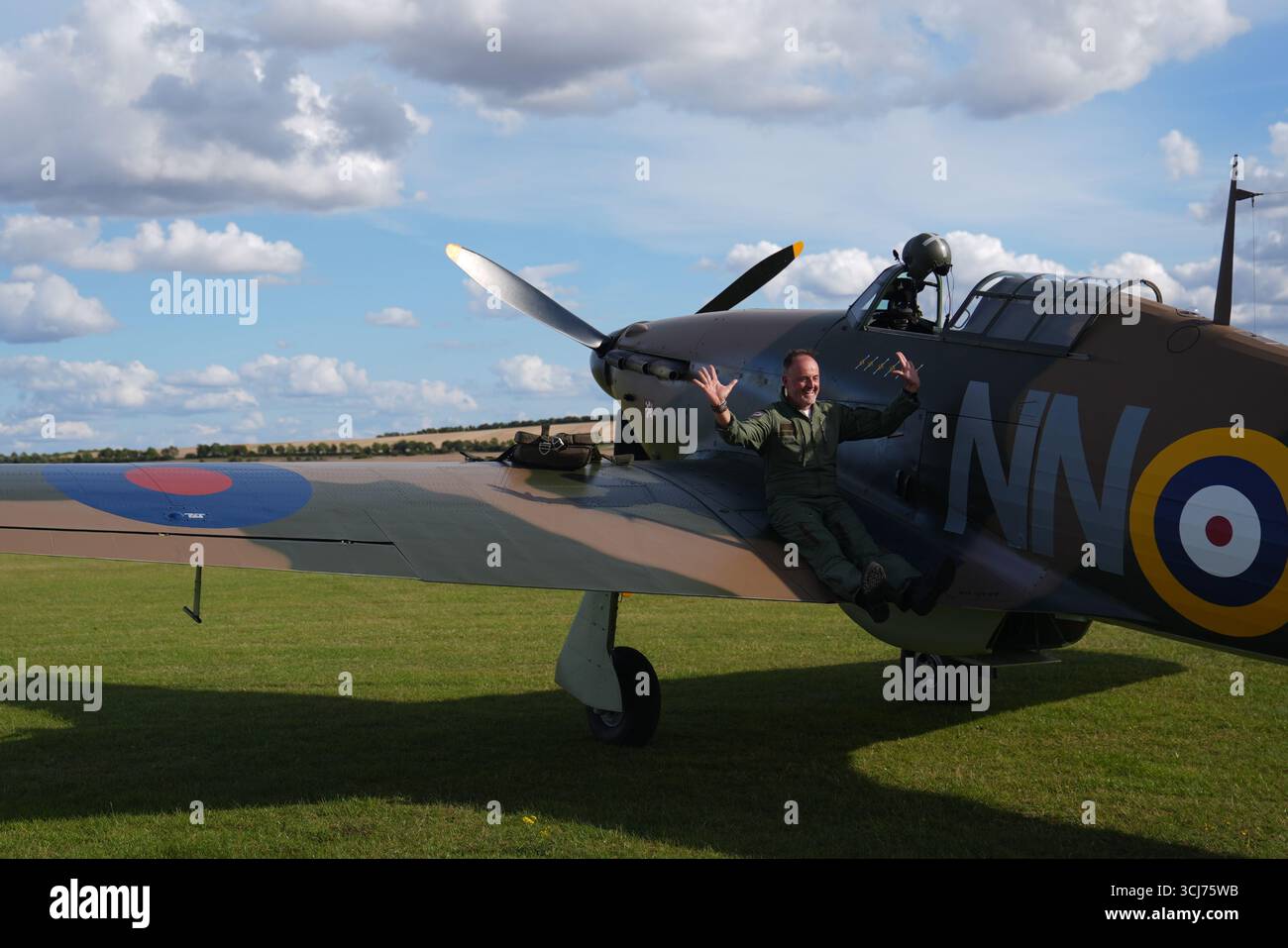 The pilot of Hurricane Mk IIa P3143, exits the aircraft ahead of the ...