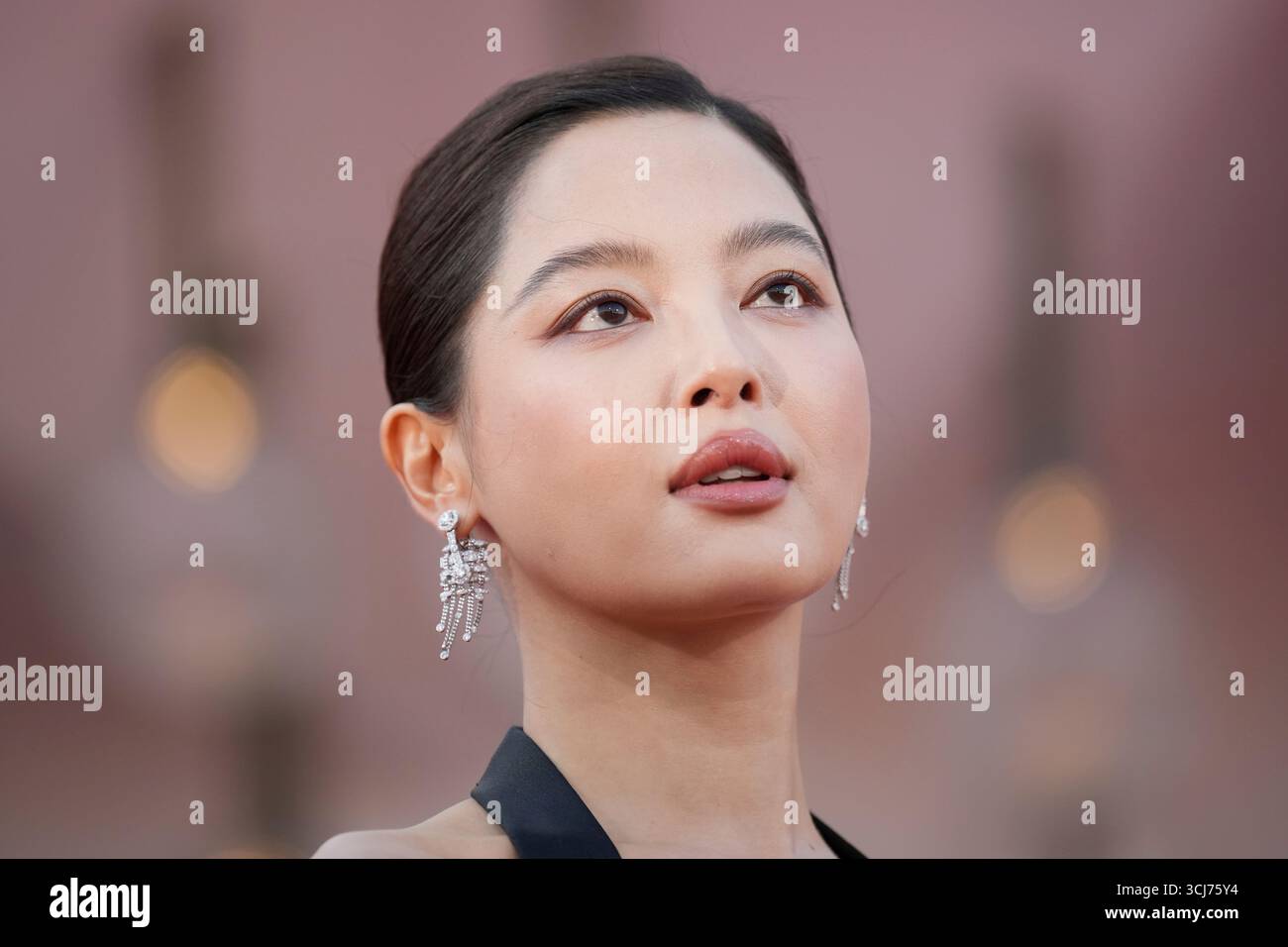 Xin Zhilei poses for photographers on the red carpet for the film 'The Sun Rises on Us All ...