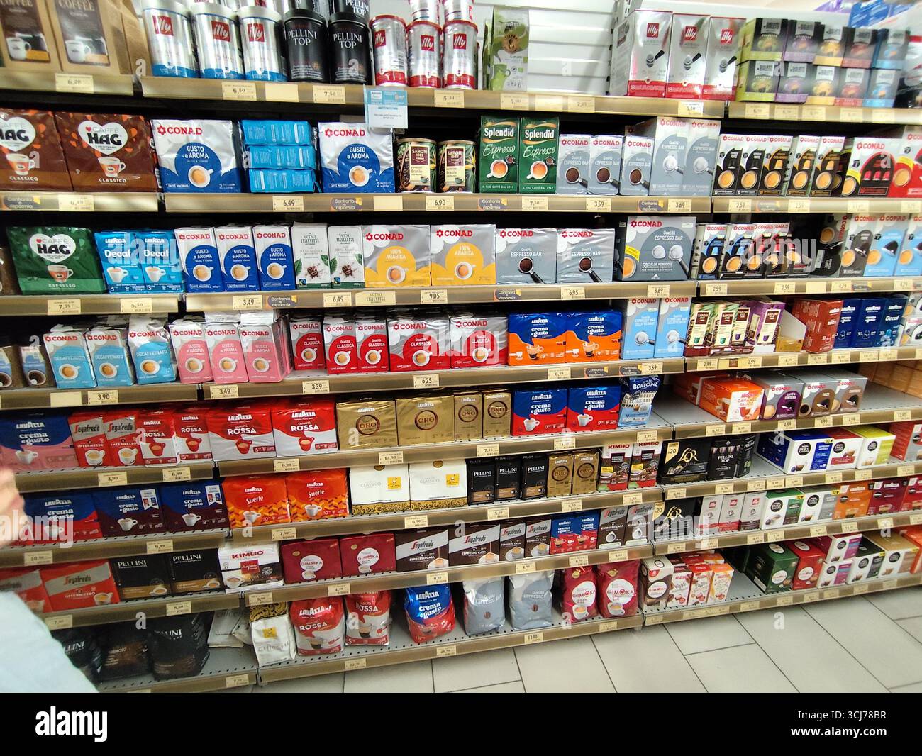 Sale of ground and bean coffee of different brands in the store CONAD ...