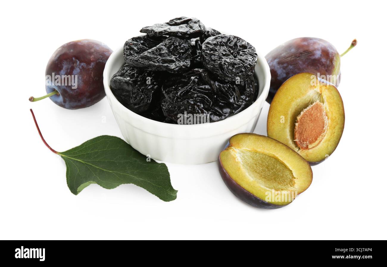 Dried prunes, fresh plums and green leaf isolated on white Stock Photo ...