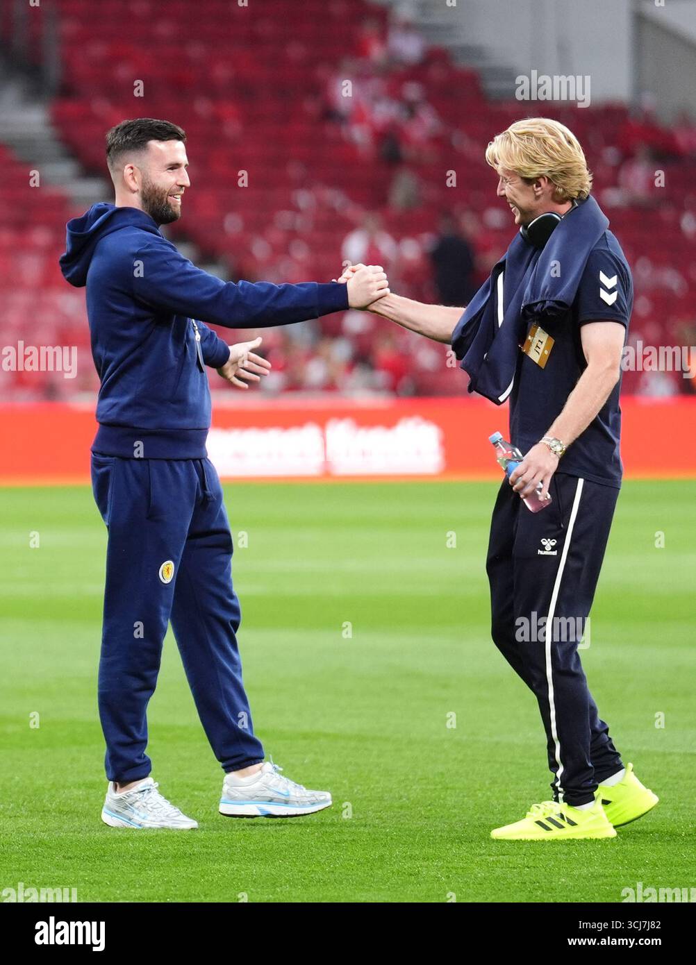 Scotland goalkeeper Liam Kelly greets Denmark's Mika Biereth ahead of ...