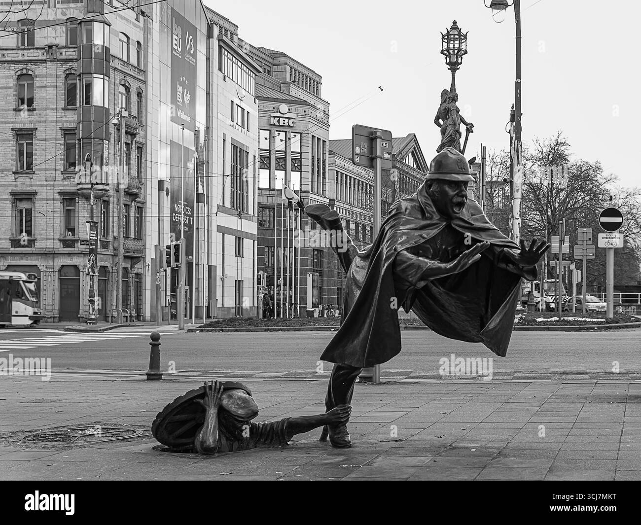 Statue at manhole Black and White Stock Photos & Images - Alamy