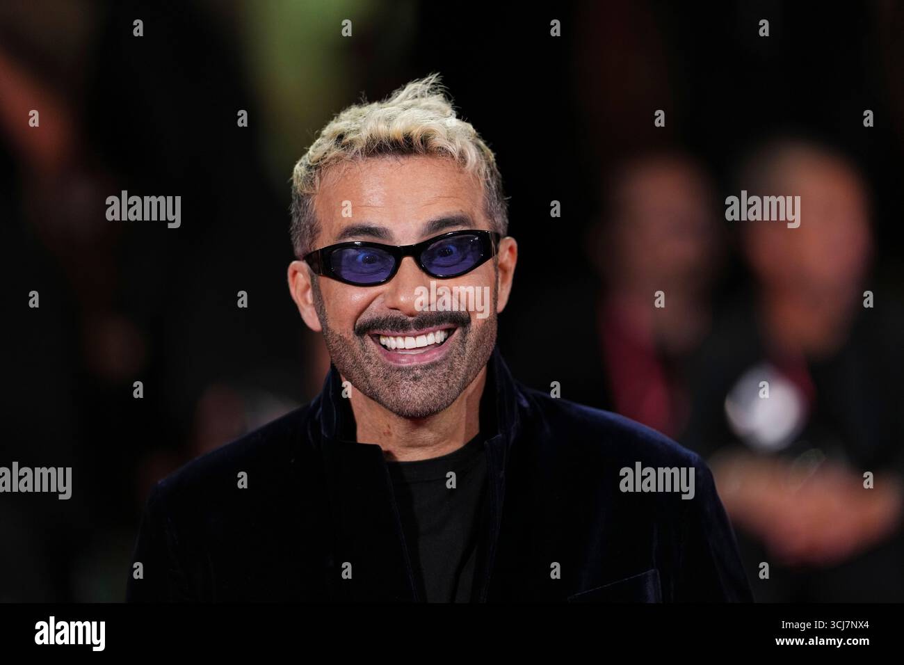 Luca Tommassini poses for photographers on the red carpet for the film ...