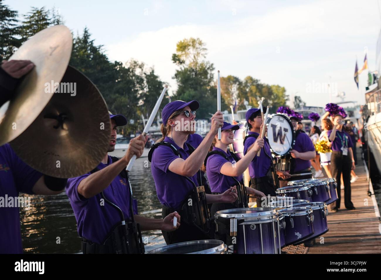 The Husky Marching Band performs for Washington fans as they tailgate ...