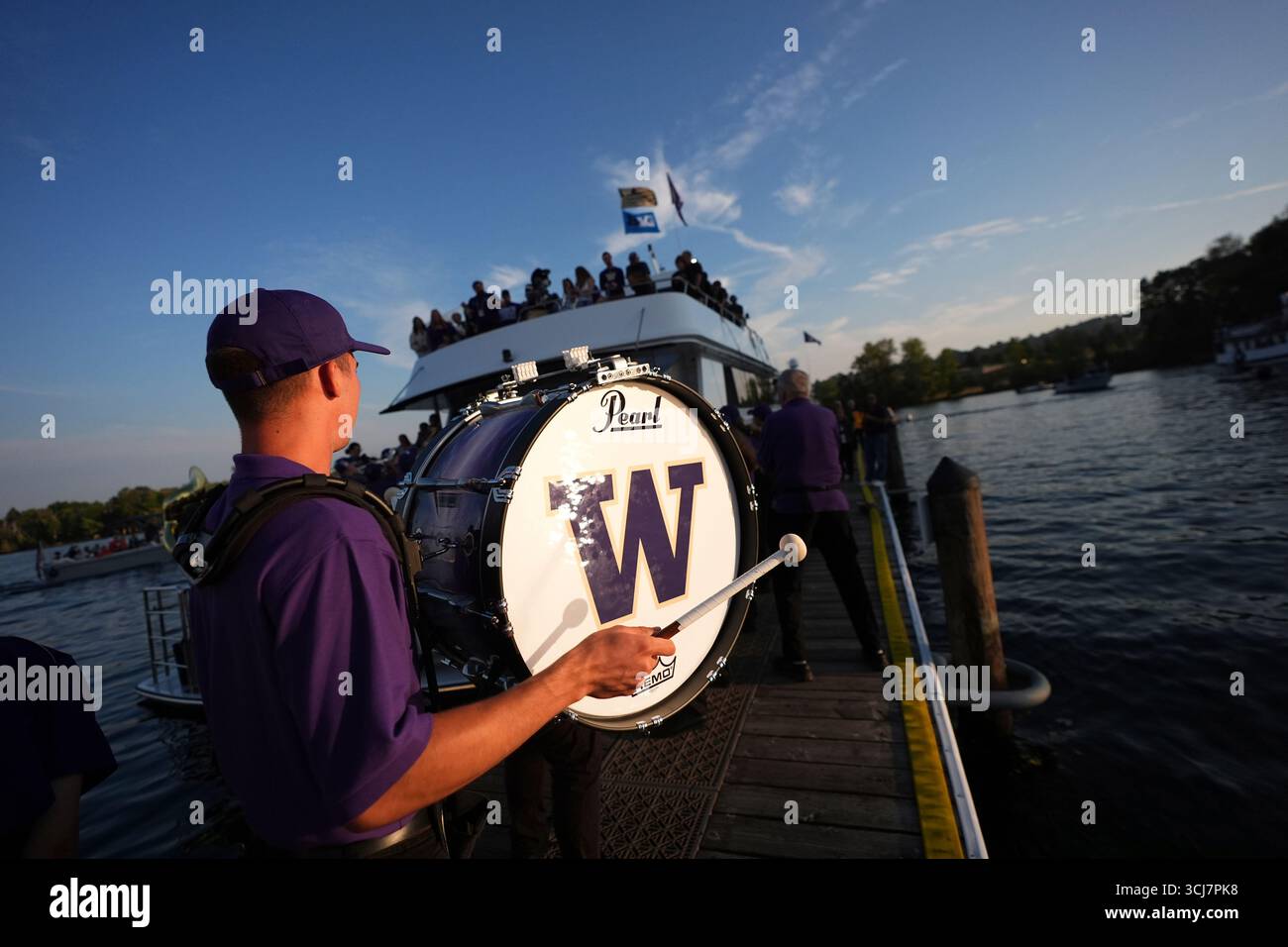 The Husky Marching Band performs for Washington fans as they tailgate ...