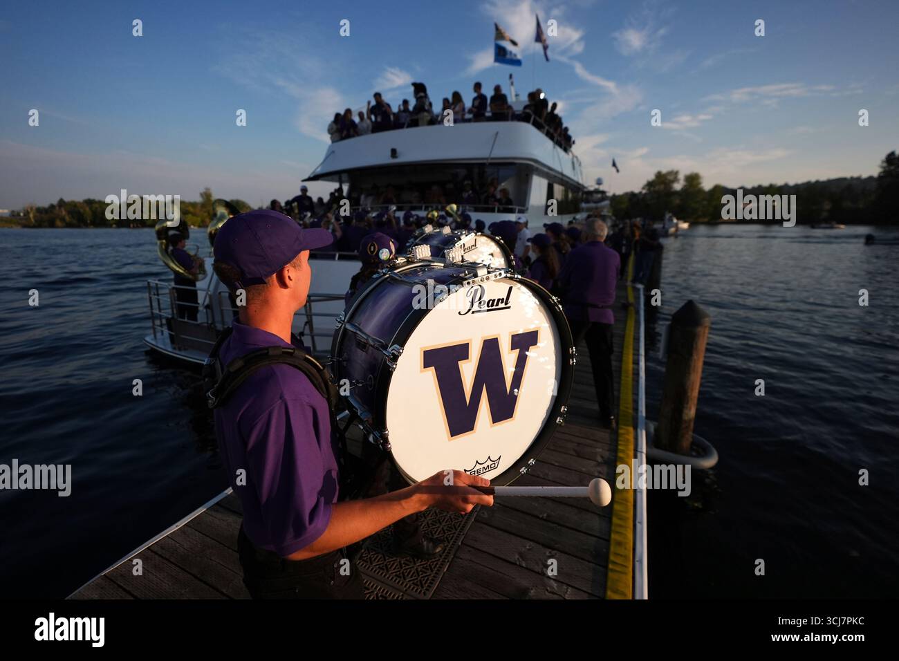 The Husky Marching Band performs for Washington fans as they tailgate ...