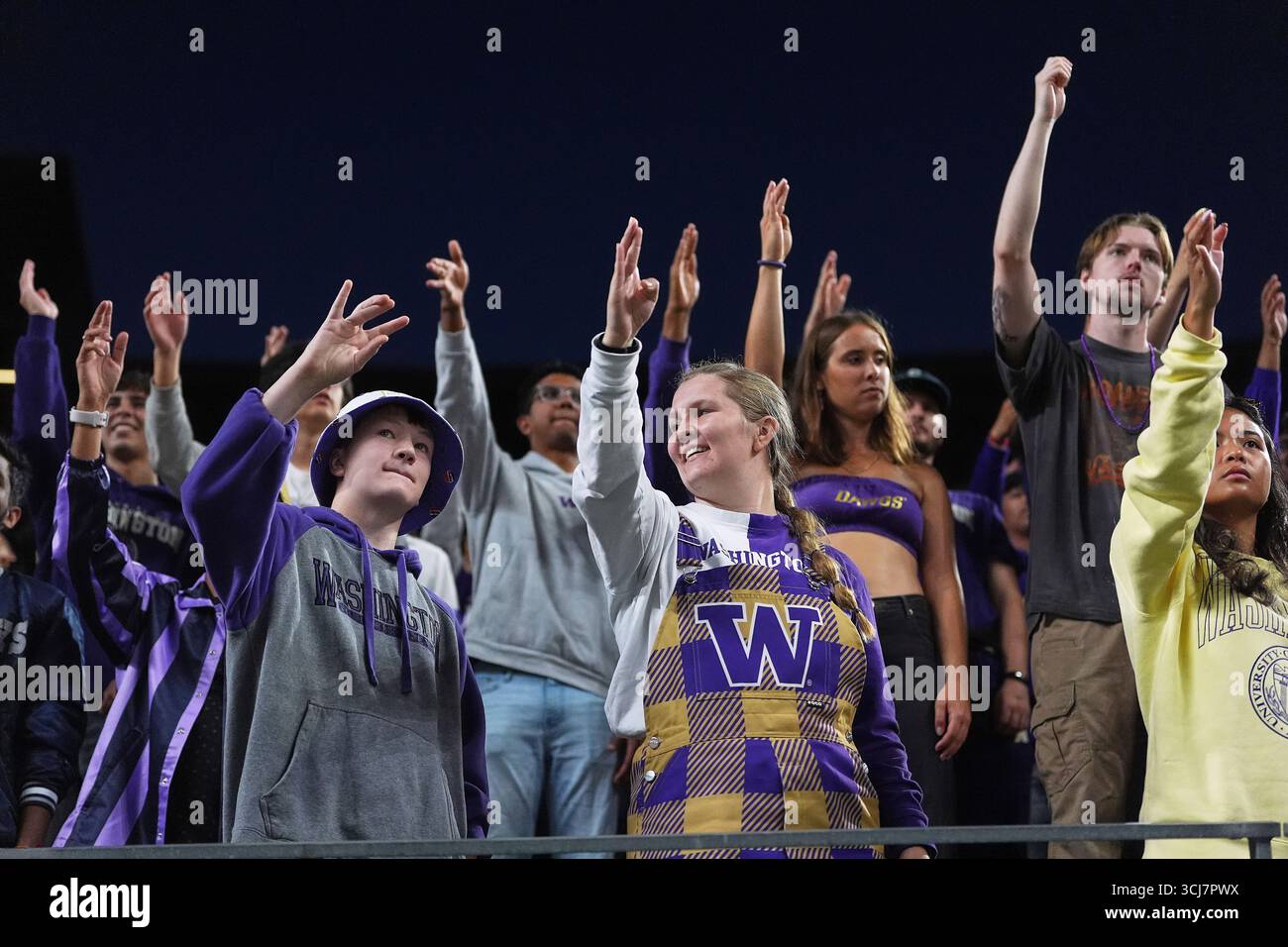 Fans cheer during an NCAA college football game between Washington and ...