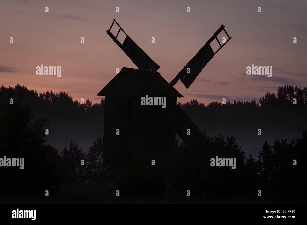 Summer landscape with old windmill at early morning. Antique wooden ...