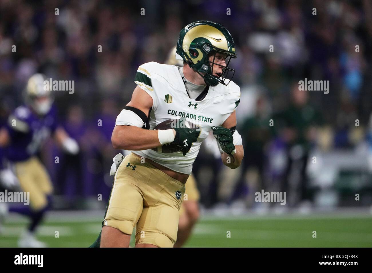 Colorado State tight end Jaxxon Warren runs the ball against Washington ...