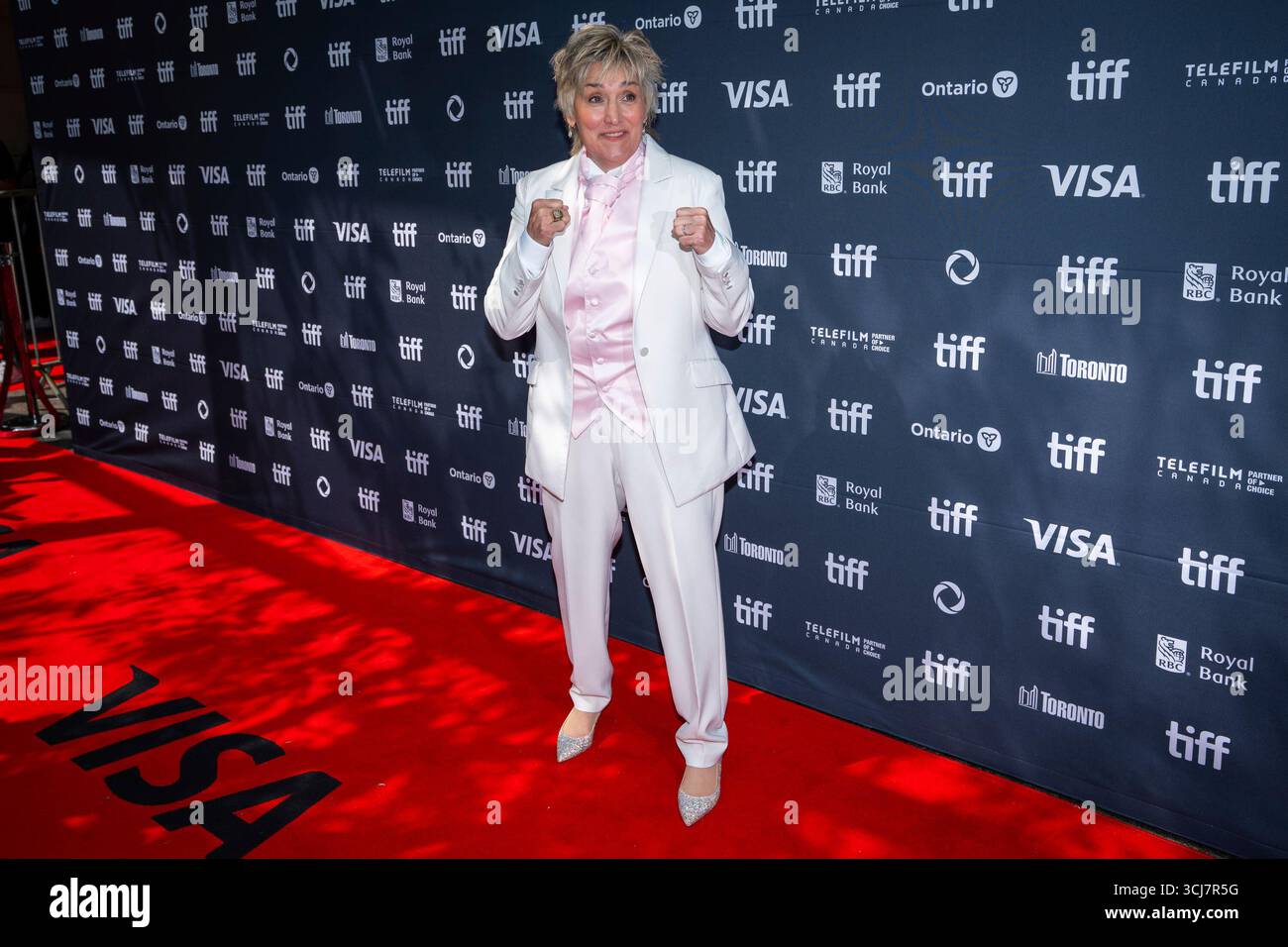 Christy Salters poses for photographs as she walks the red carpet at ...