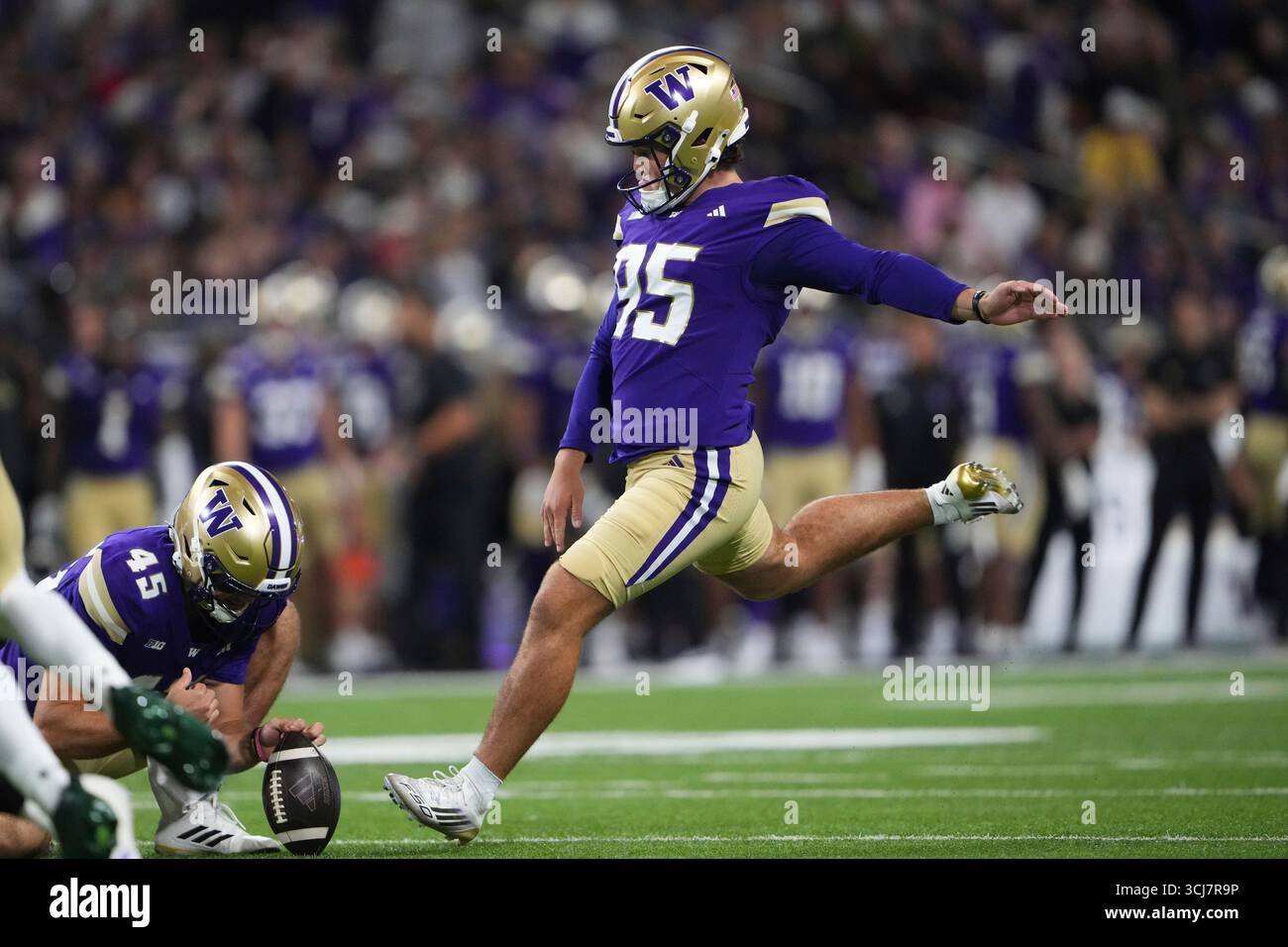 Washington place-kicker Grady Gross makes an extra point kick with ...