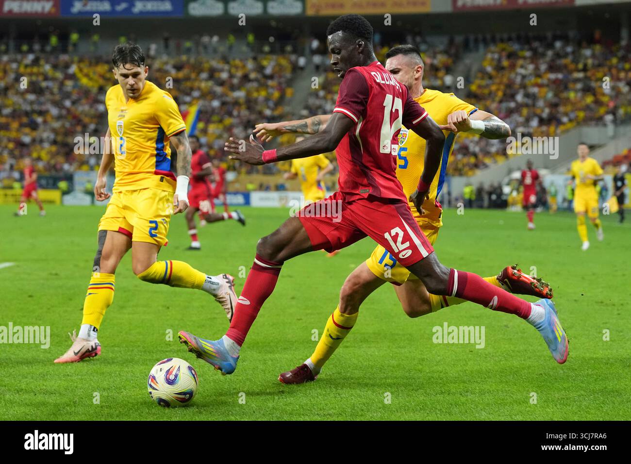 Romania's Andrei Burca, right, tackles Canada's Tani Oluwaseyi during ...