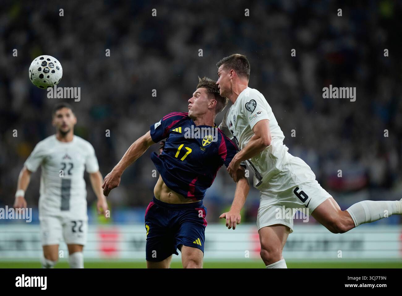 Sweden's Viktor Gyokeres, left, and Slovenia's Jaka Bijol jump for the ...