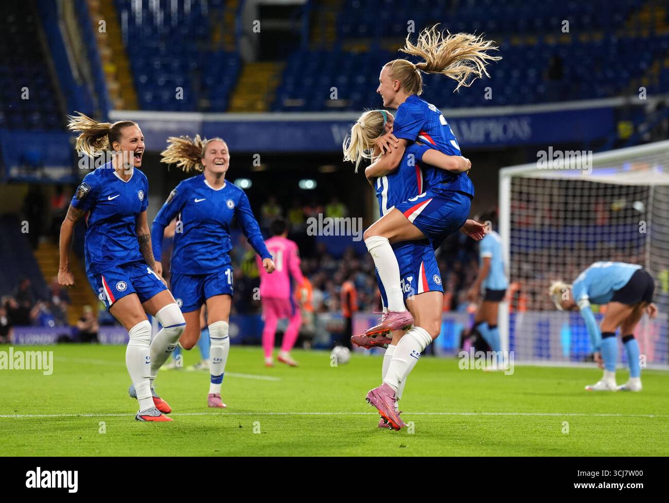 Chelsea's Aggie Beever-Jones (right) celebrates with Ellie Carpenter ...