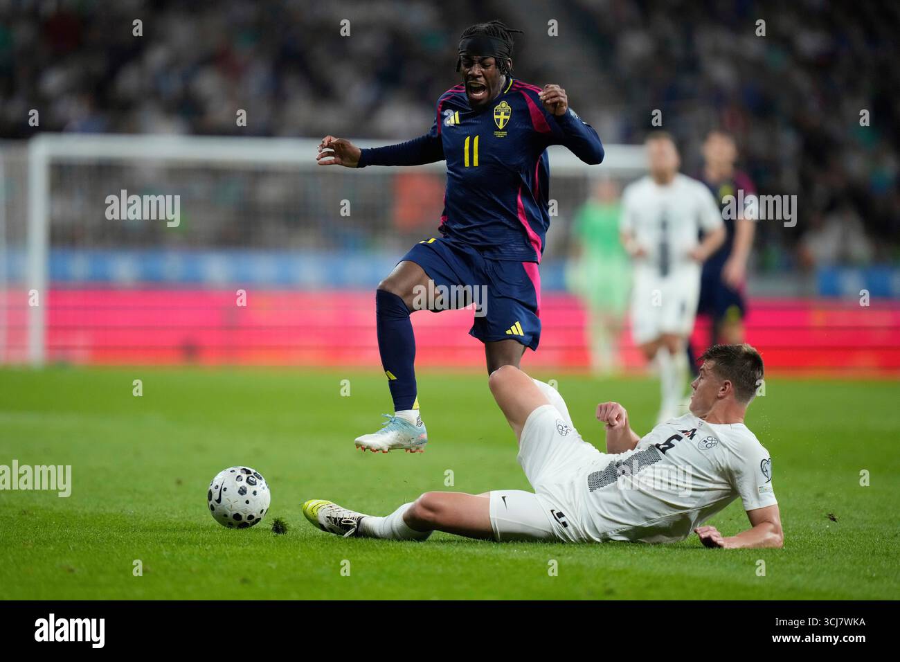 Slovenia's Jaka Bijol tackles Sweden's Anthony Elanga during the World ...