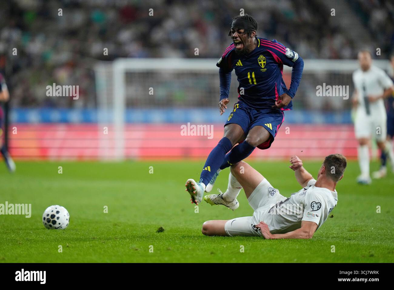 Slovenia's Jaka Bijol tackles Sweden's Anthony Elanga during the World ...