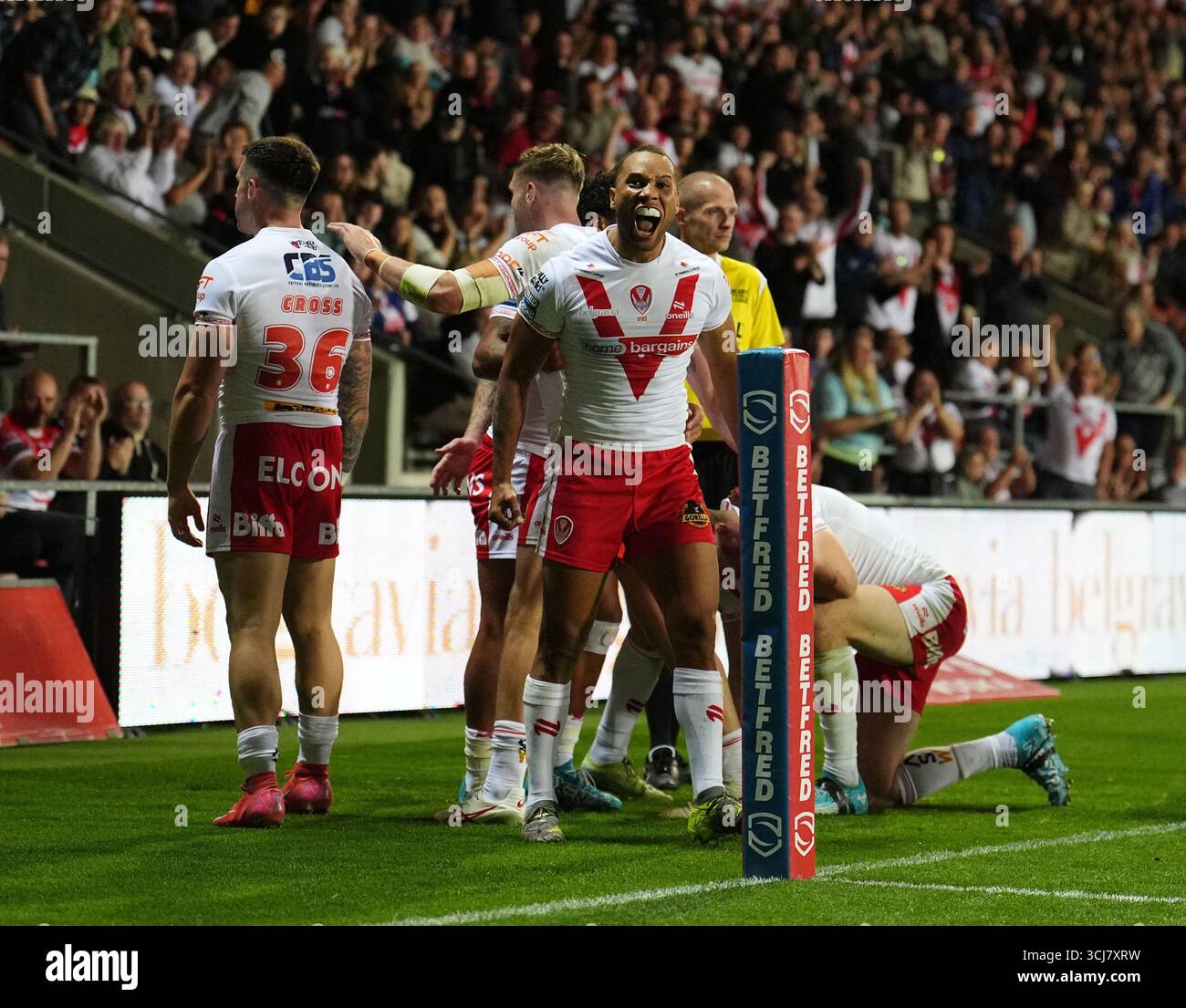 St Helens' Moses Mbye celebrates with teammates during the Betfred ...