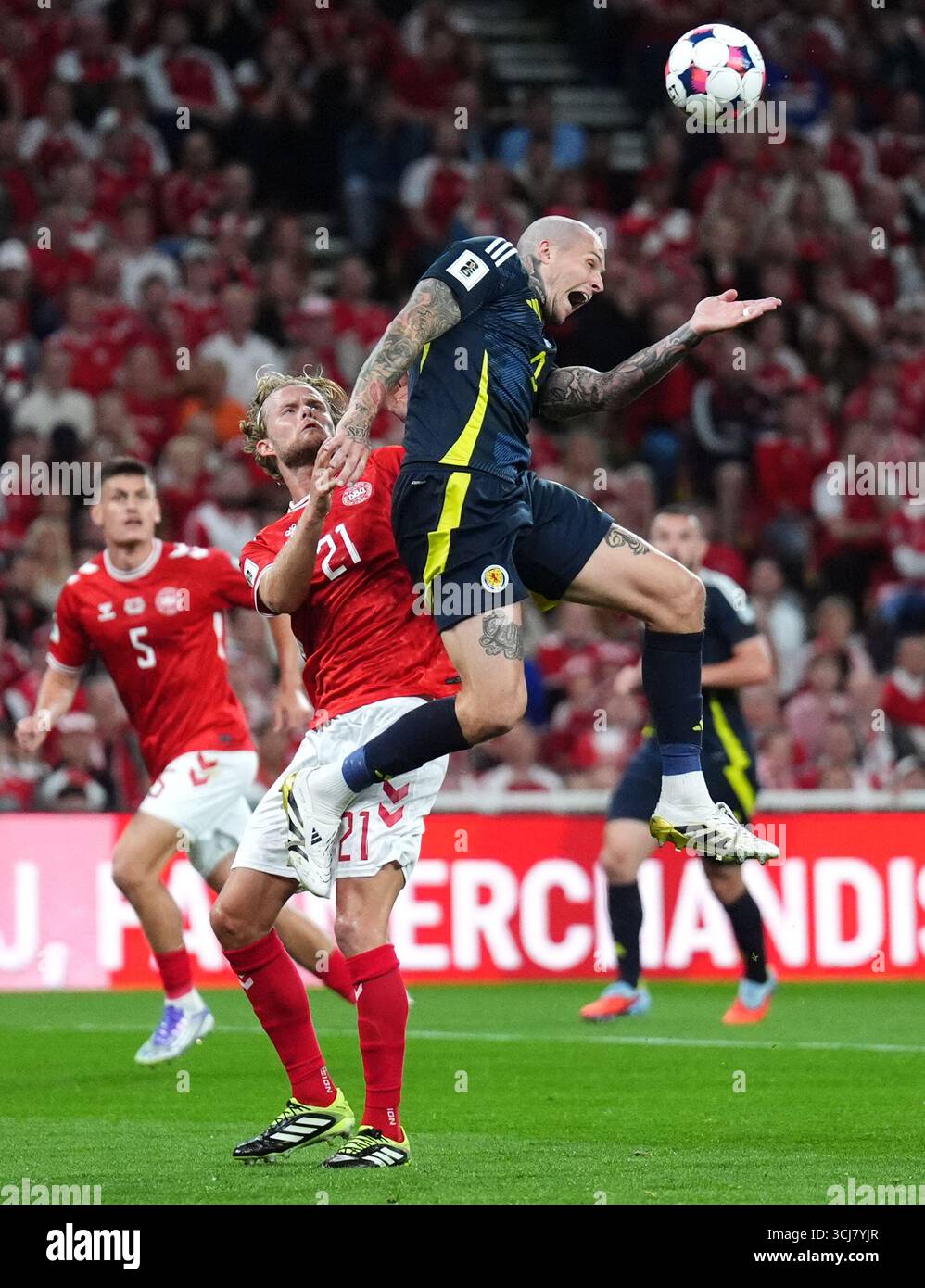 Denmark's Morten Hjulmand and Scotland's Lyndon Dykes battle for the ...