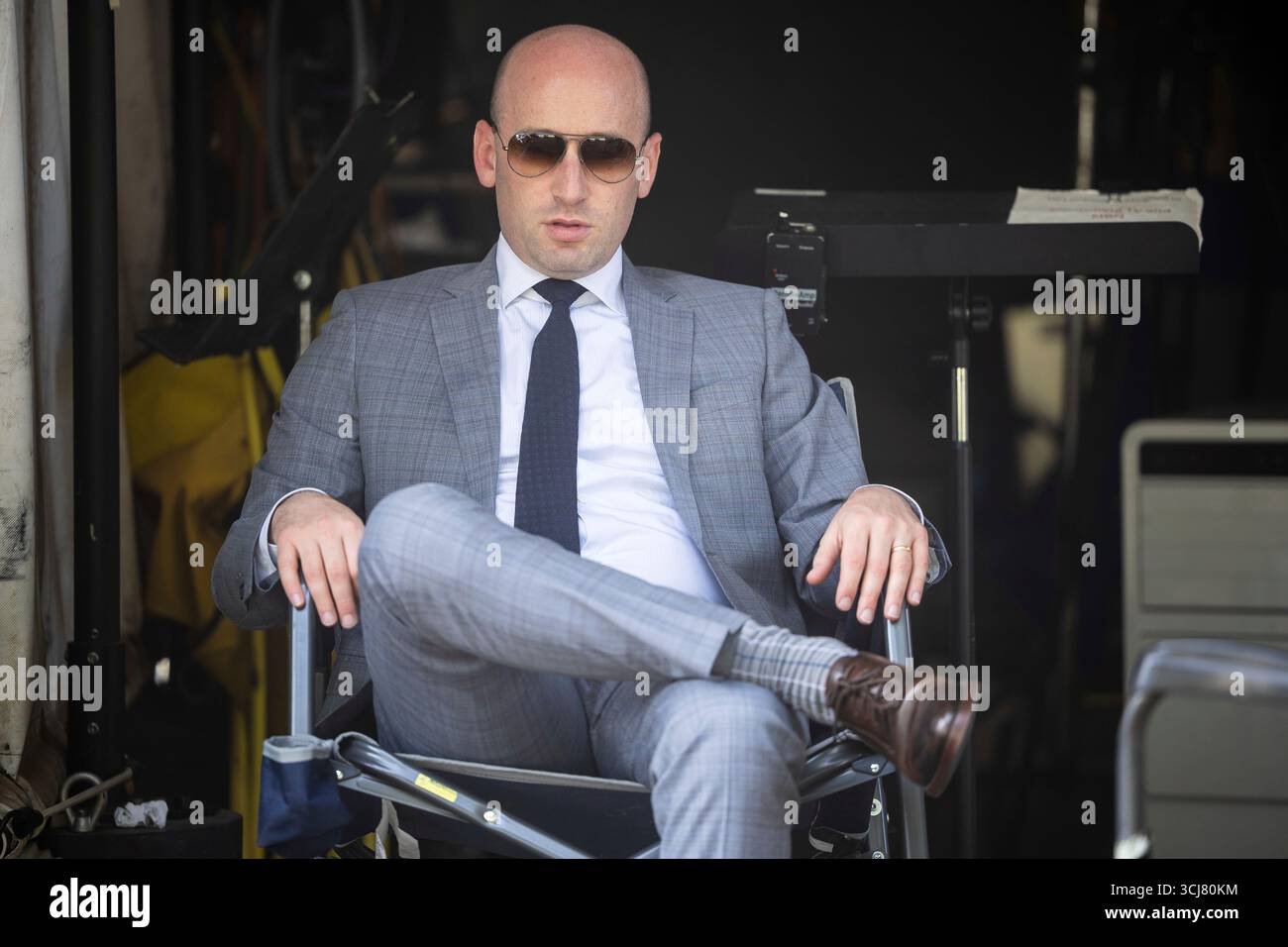 White House Deputy Chief of Staff Stephen Miller sits on a chair as he ...