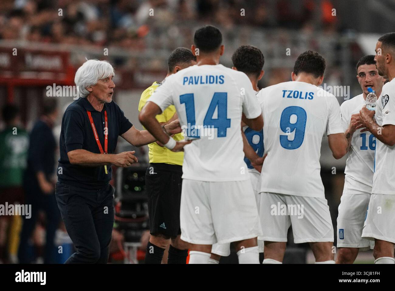Greece's head coach Ivan Jovanovic, left, talks to players during the ...