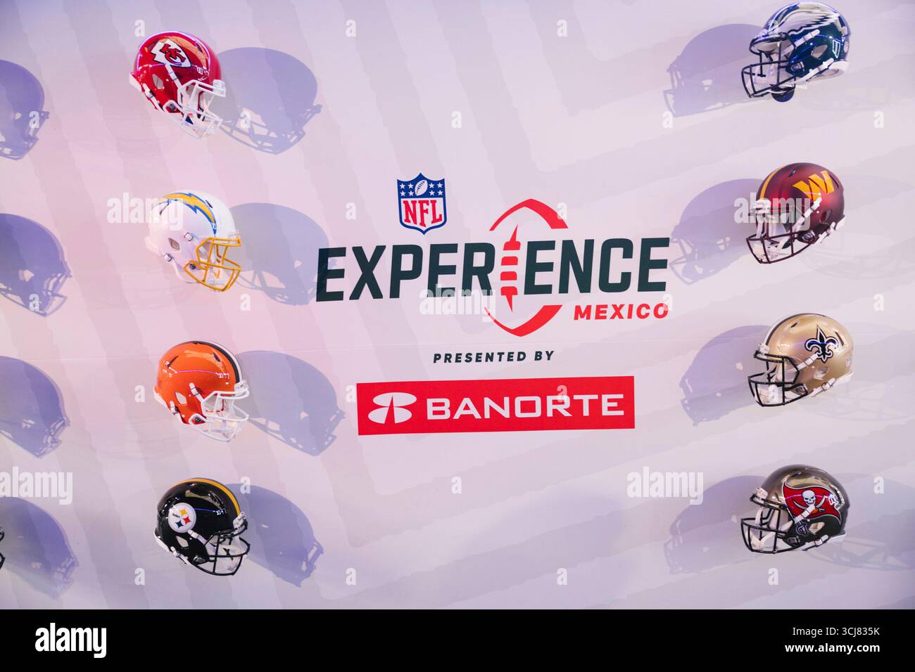 Football helmets on display at the NFL Experience México event in ...
