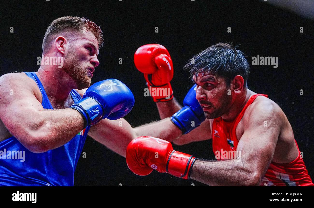 Ireland's Martin McDonagh (left) and India's Narender Narender compete ...