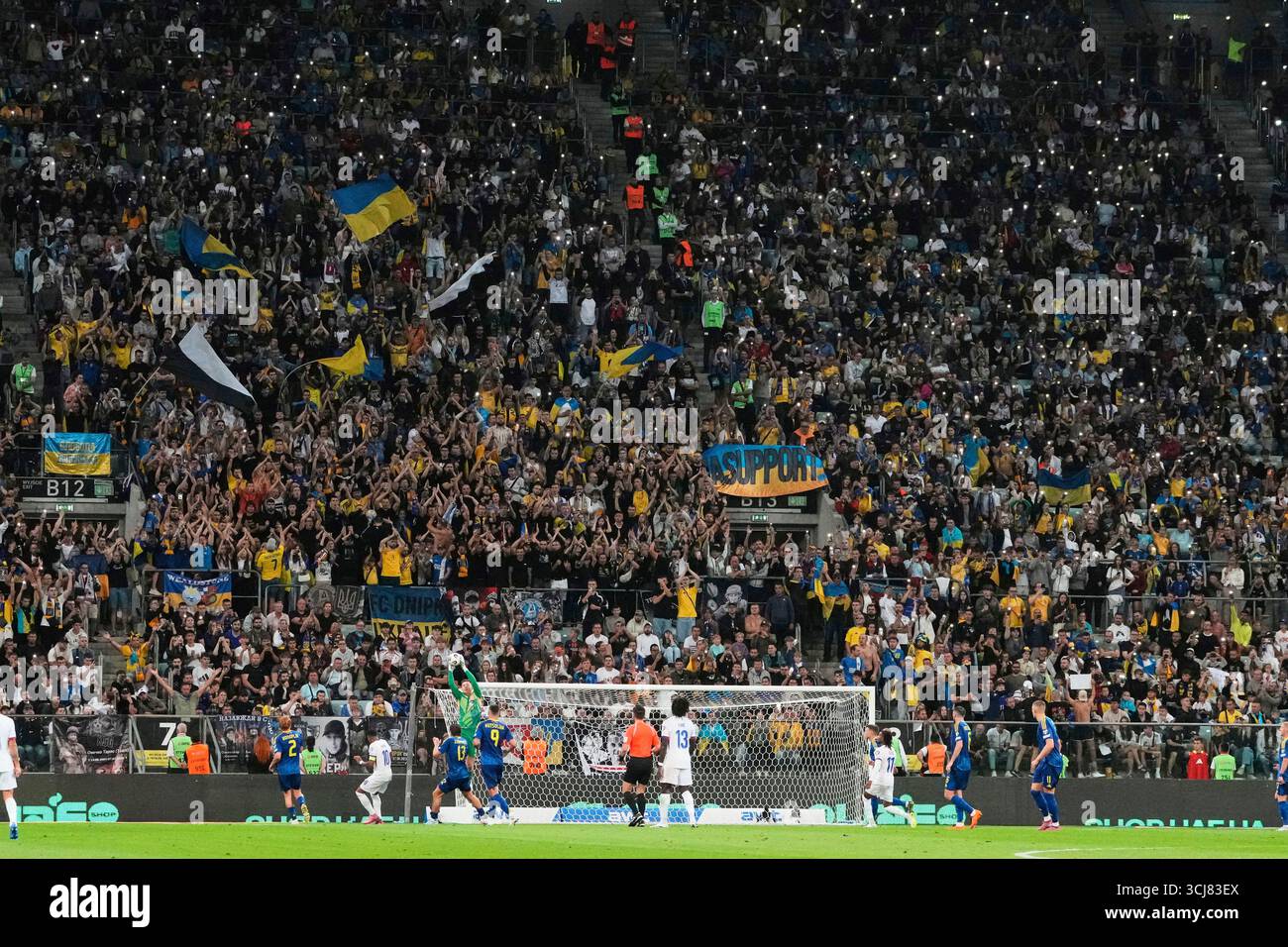 Ukrainian fans cheer during the 2026 FIFA World Cup qualifying soccer ...