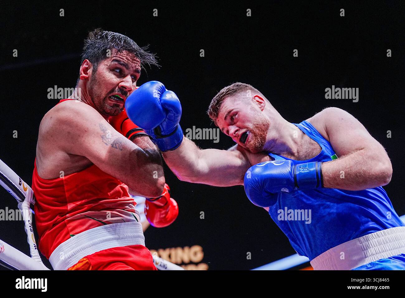 Ireland's Martin McDonagh (BLUE) and India's Narender Narender (RED ...