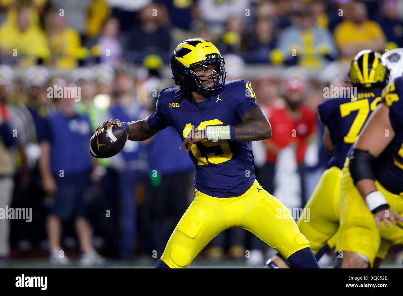 Michigan quarterback Bryce Underwood looks to pass during an NCAA football game on Saturday, Aug ...