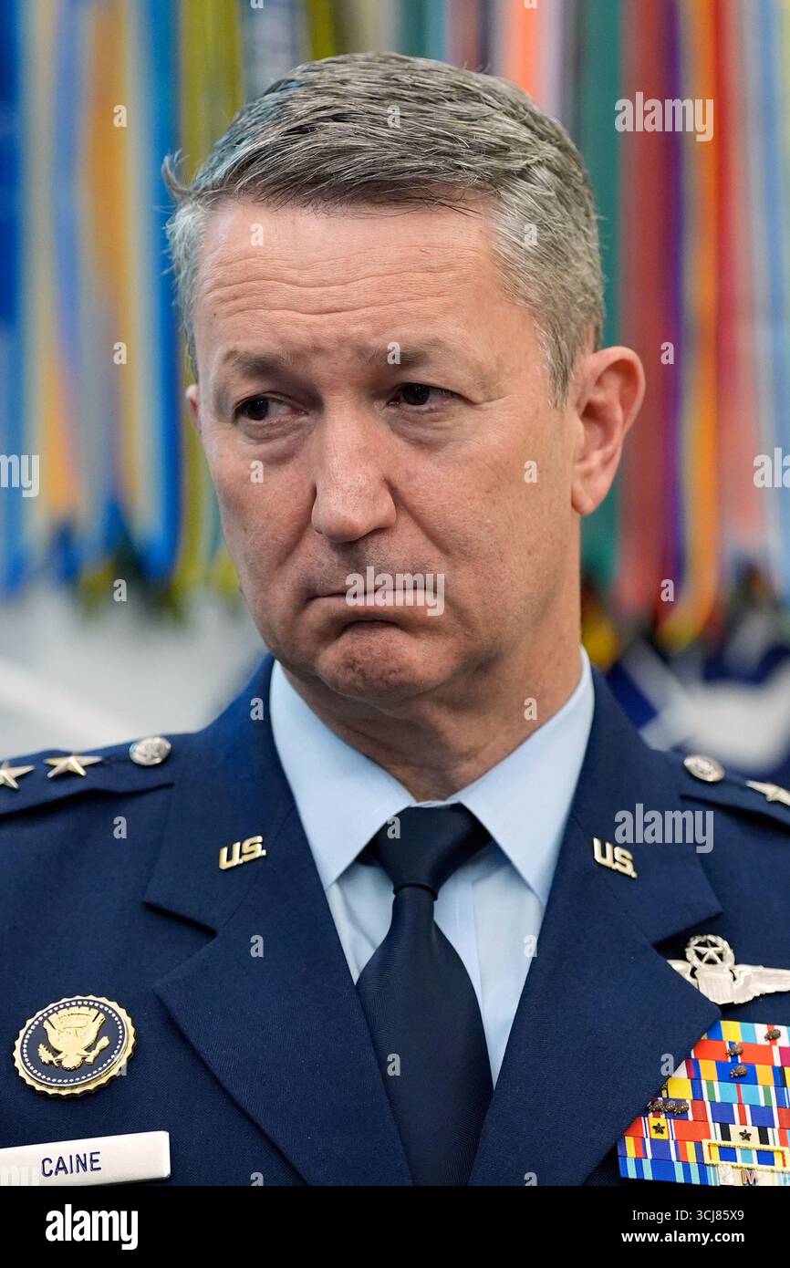 Chairman of the Joint Chiefs of Staff Gen. Dan Caine listens as ...