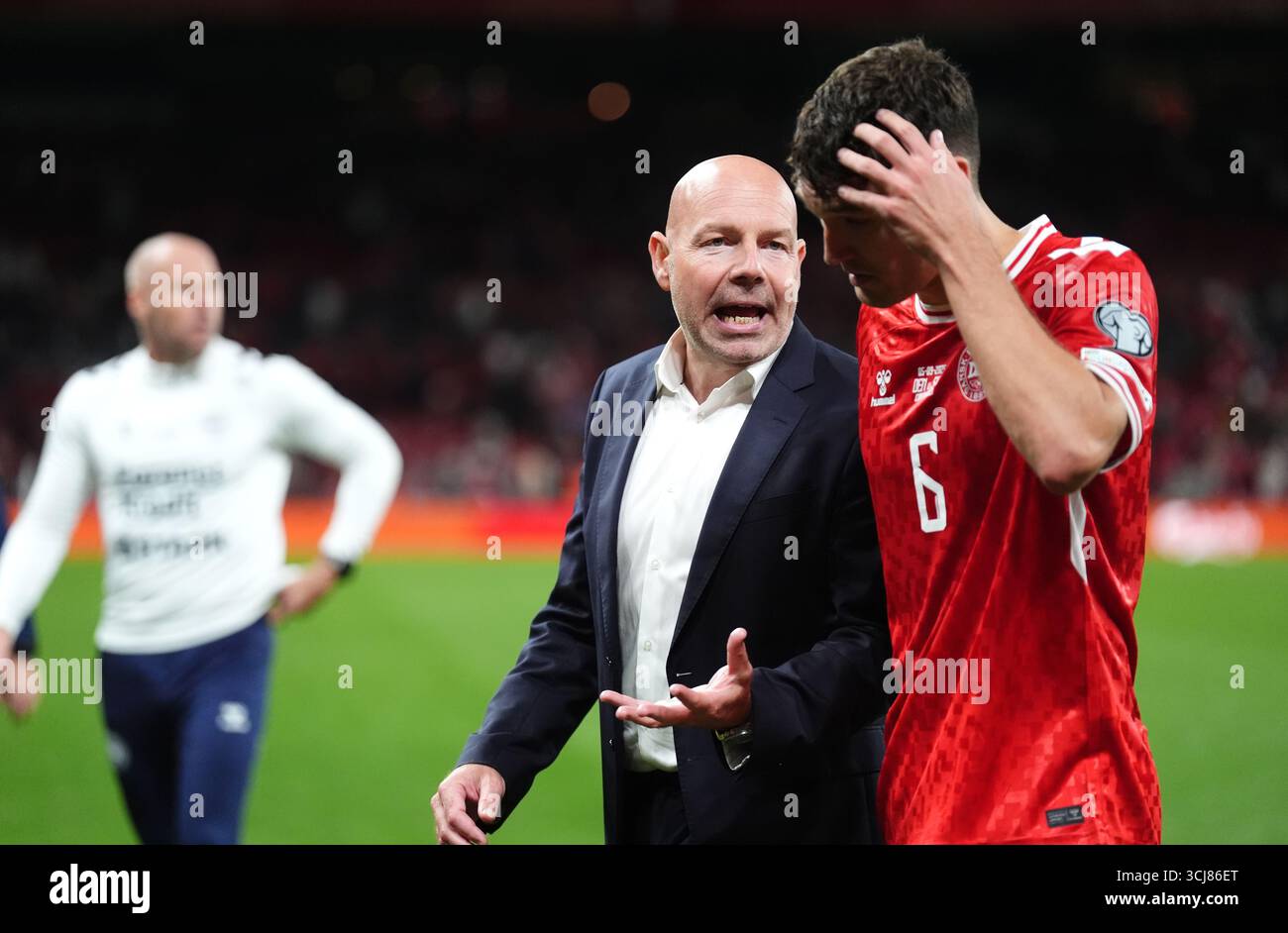 Denmark manager Brian Riemer talks to Andreas Christensen following the ...