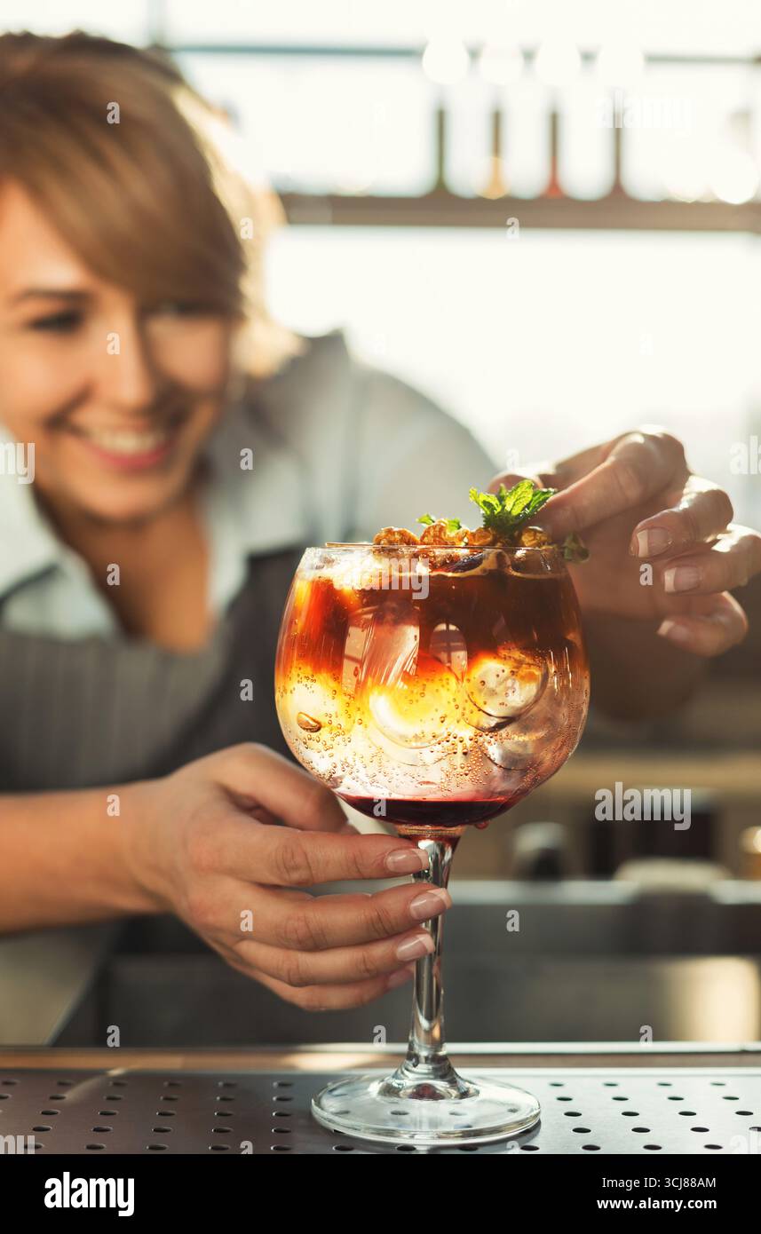 Female hand pour cocktail hi-res stock photography and images - Alamy