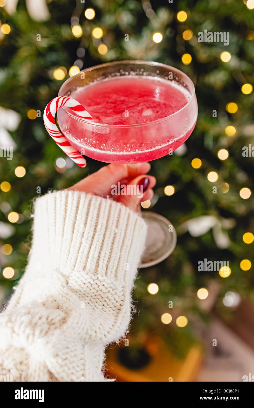 Hand holds candy cane hi-res stock photography and images - Alamy