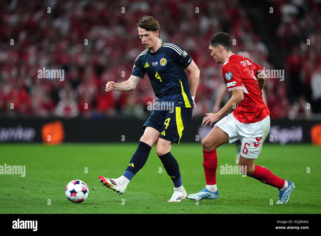 Scotland's Scott McTominay and Denmark's Andreas Christensen battle for the ball during the ...