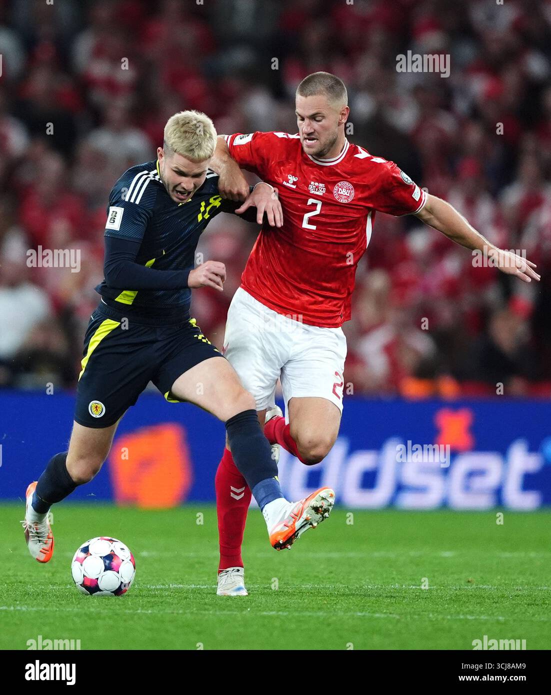 Scotland's George Hirst (left) and Denmark's Joachim Andersen battle ...