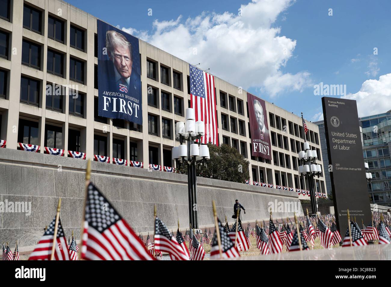 A large photograph of U.S. President Donald Trump in Washington, DC ...