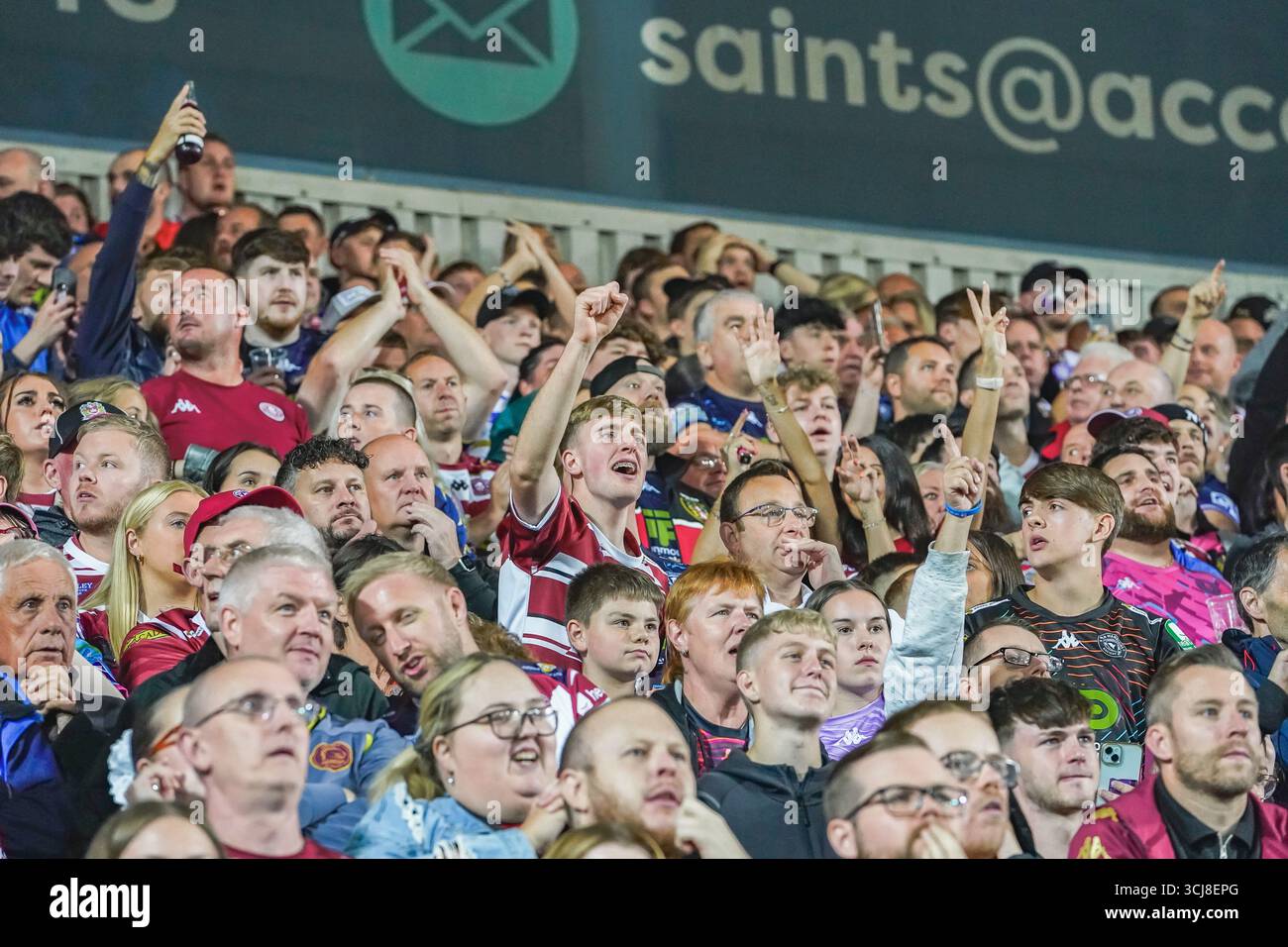 ST HLENES, ENGLAND - September 5: Wigan fans singing during the game ...