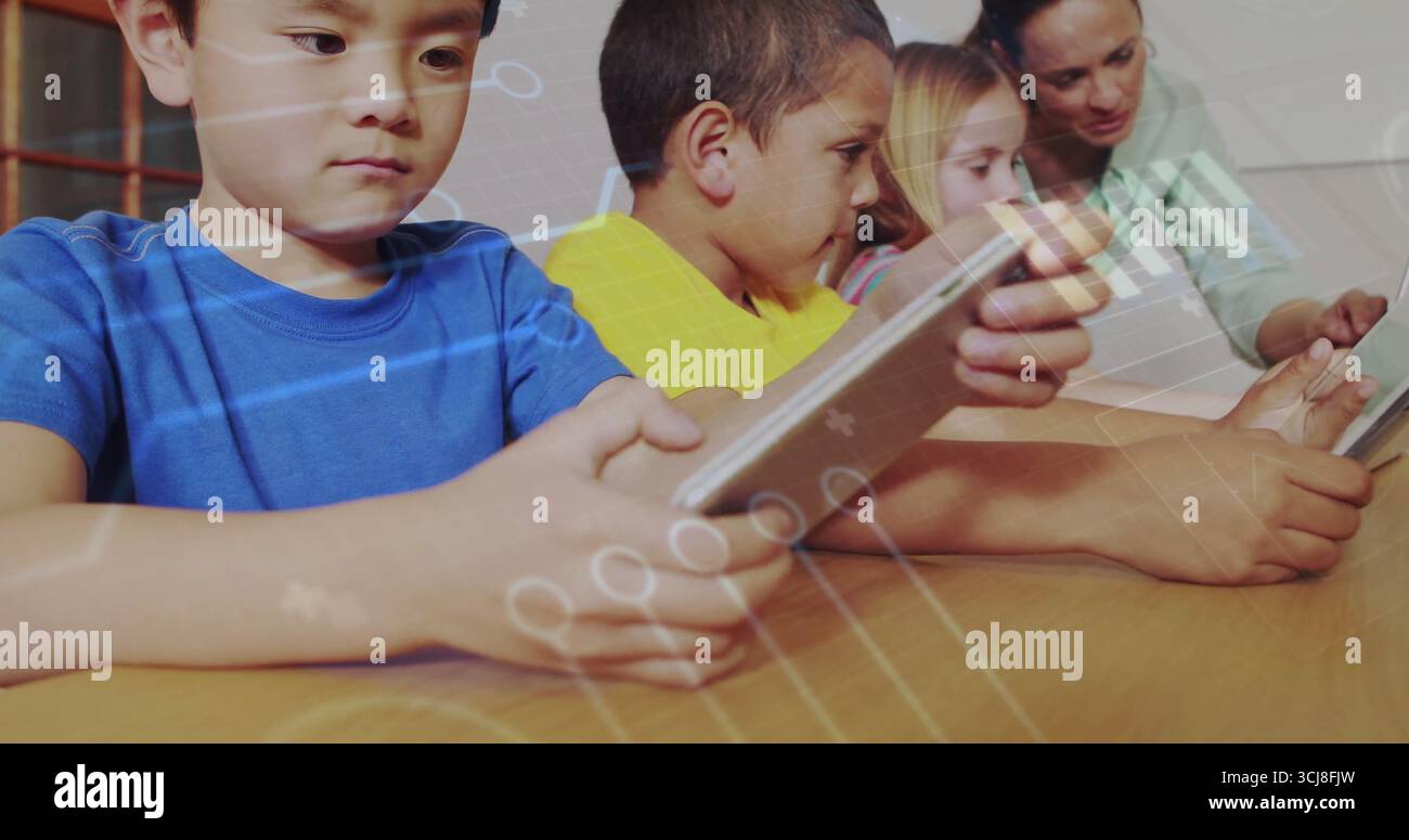 Guiding teacher assisting children using tablets at wooden table in ...