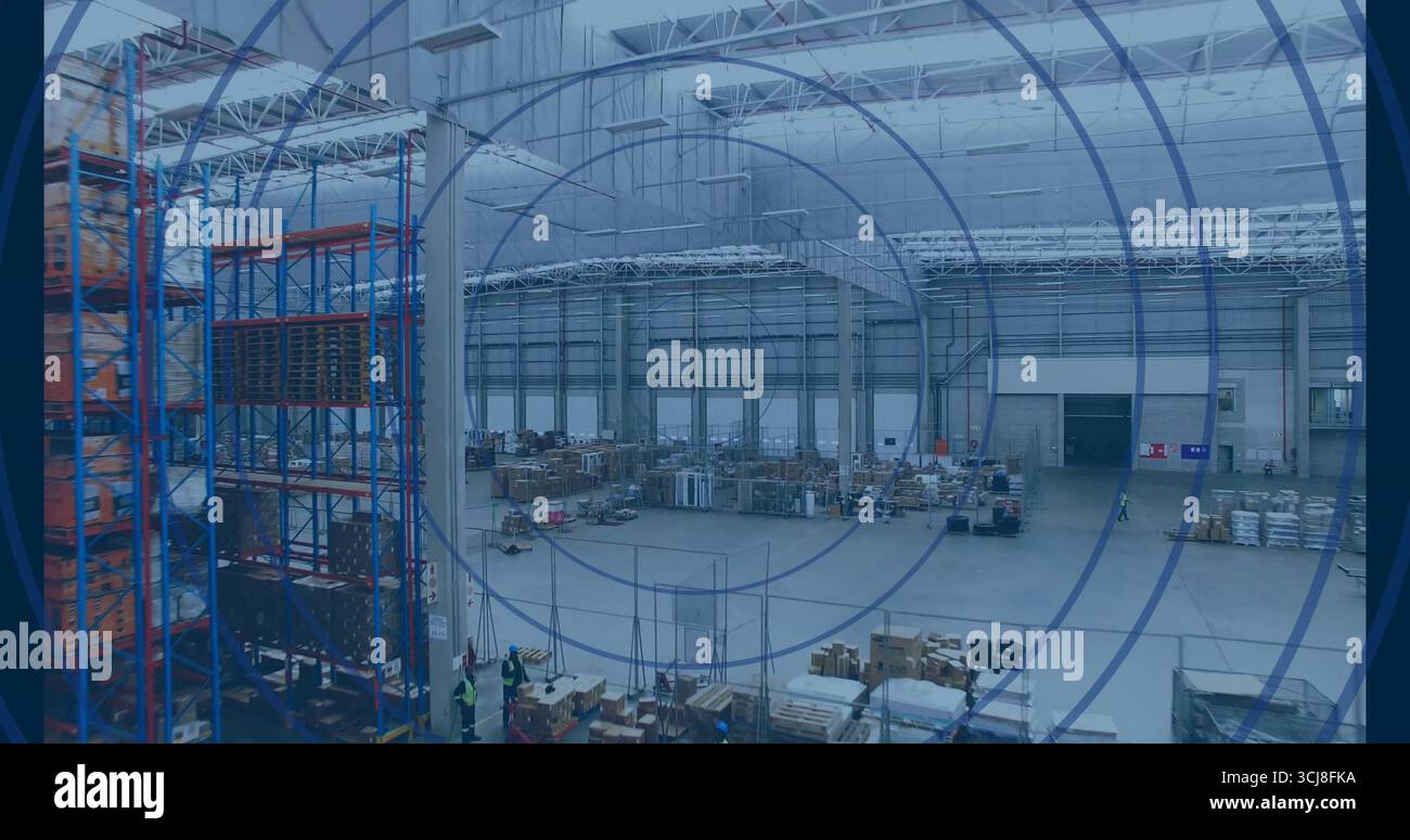 Organizing team in warehouse wearing helmets, vests handling boxes and ...