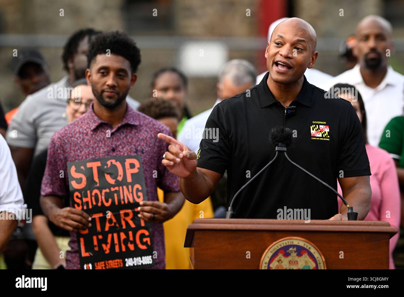 Maryland Gov. Wes Moore, right, speaks next to Baltimore mayor Brandon ...