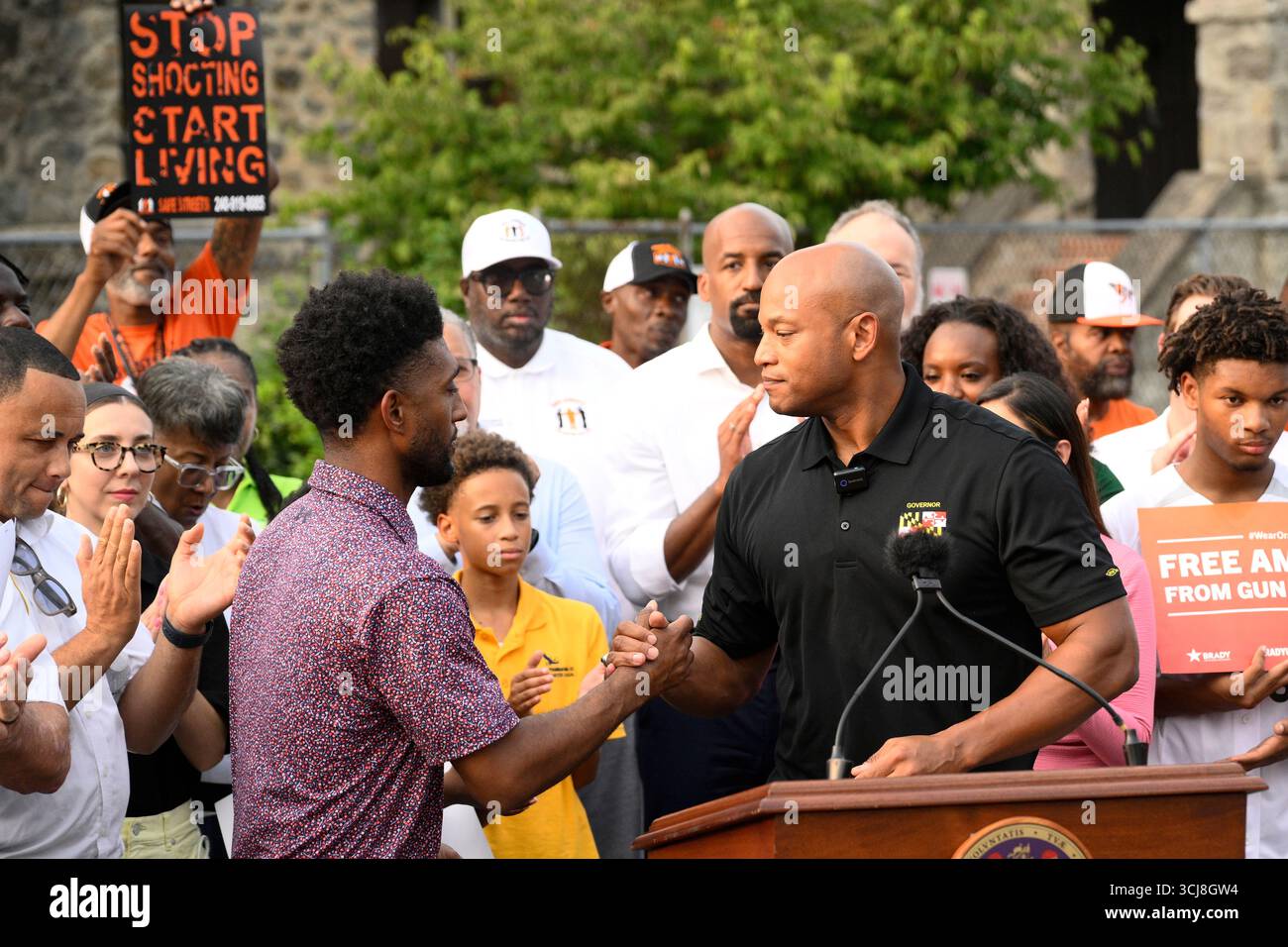 Maryland Gov. Wes Moore, right, shakes hands with Baltimore mayor ...
