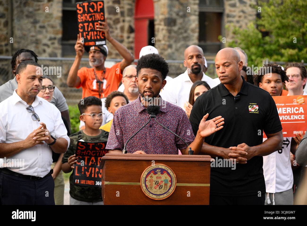 Baltimore mayor Brandon Scott, center, speaks next to Maryland Gov. Wes ...