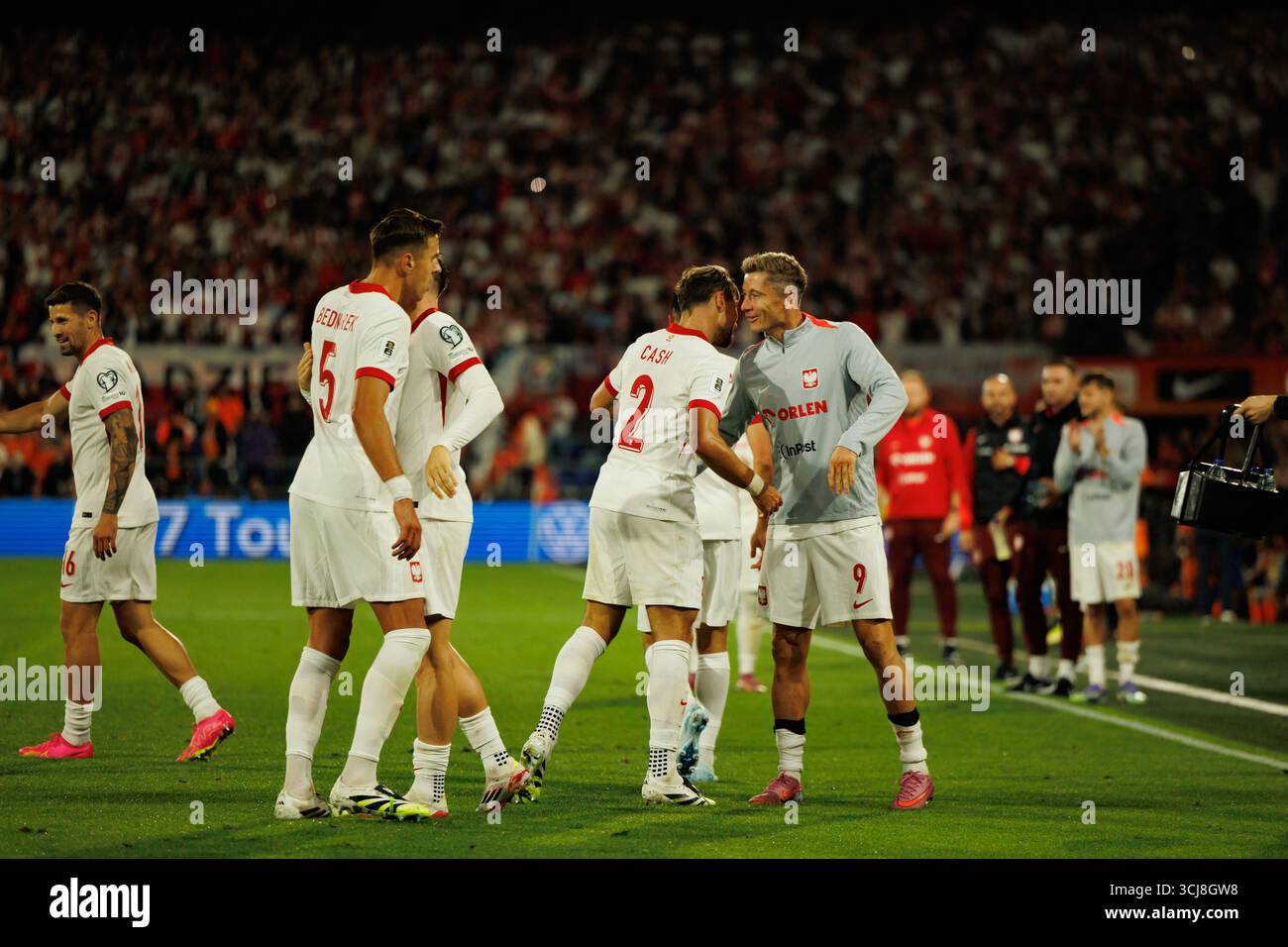 Matty Cash and Robert Lewandowski seen celebrating after goal during ...
