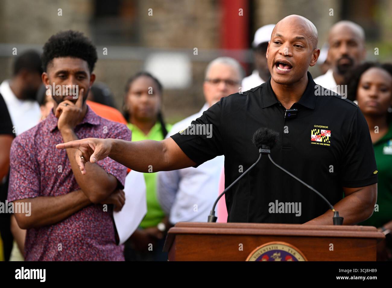 Maryland Gov. Wes Moore, right, speaks next to Baltimore mayor Brandon ...