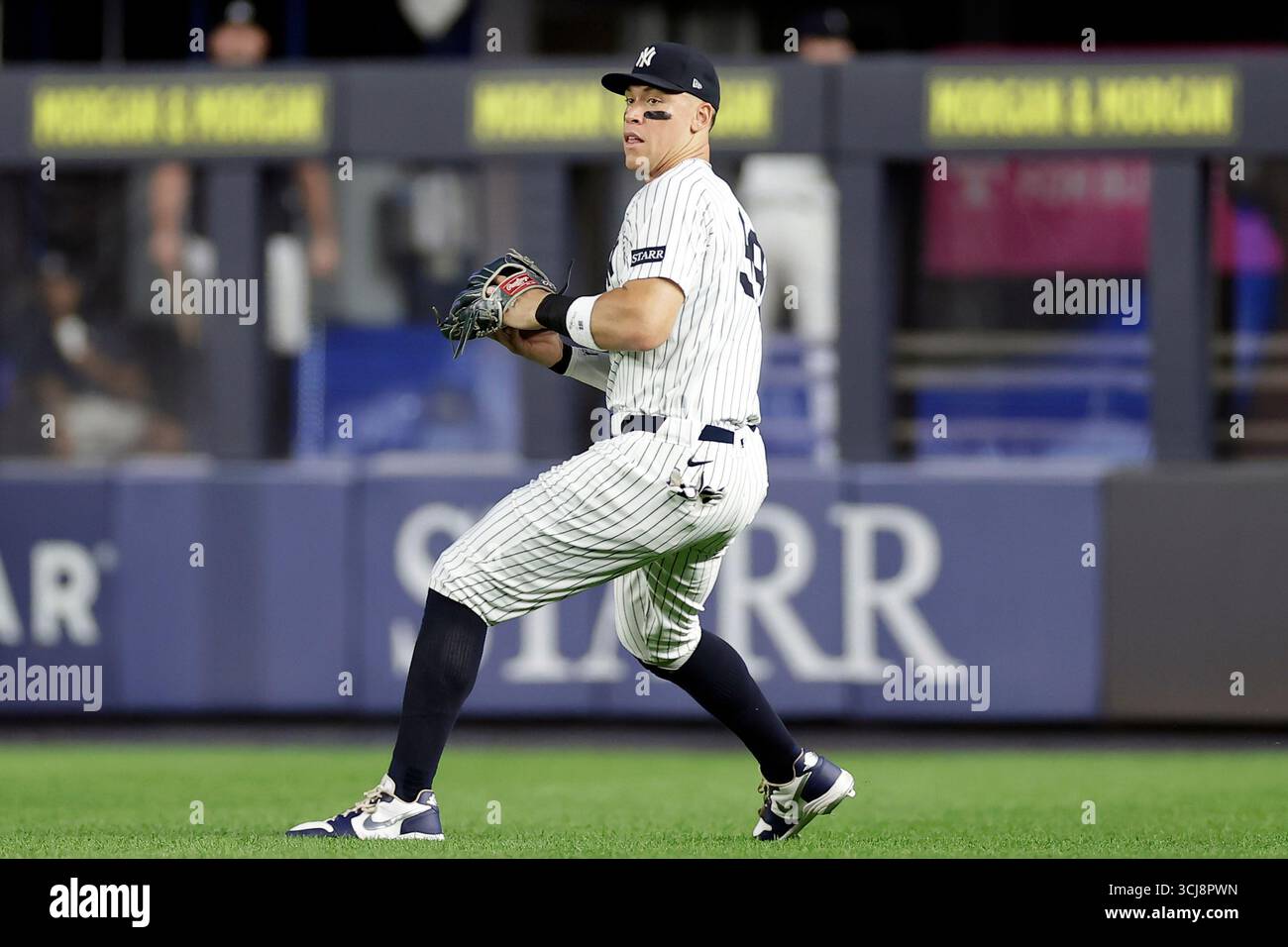 New York Yankees outfielder Aaron Judge fields a ball hit by Toronto ...