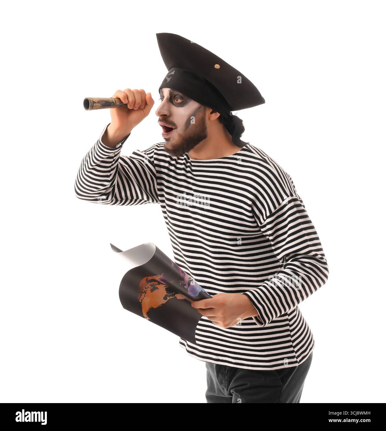 Young shocked man dressed as pirate for Halloween with spyglass and ...