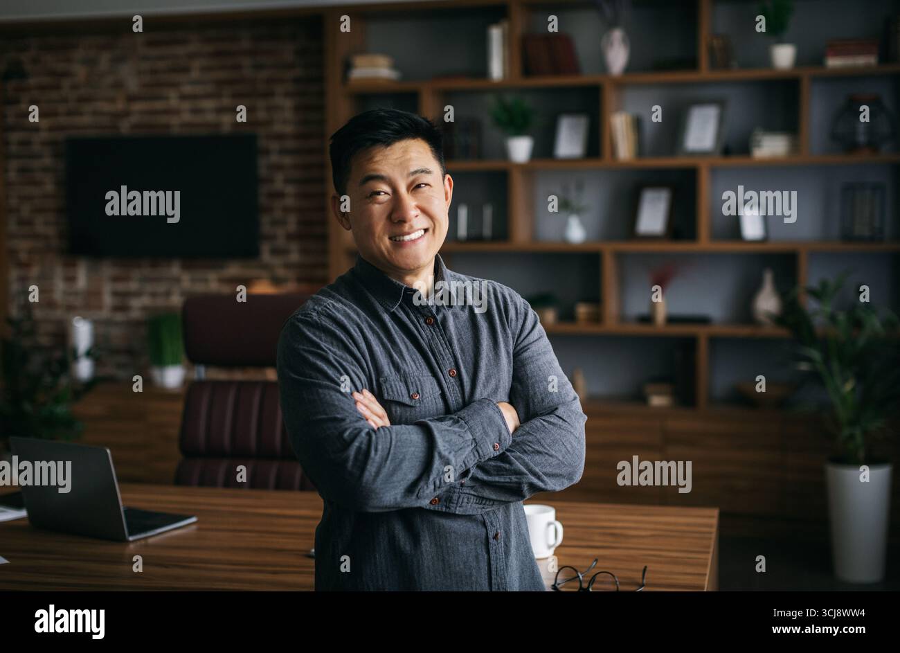 Happy confident handsome mature japanese businessman with crossed arms ...