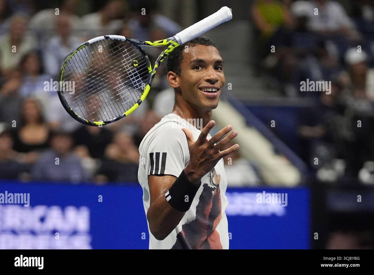 Felix Auger-Aliassime, of Canada, reacts after missing a shot by Jannik ...