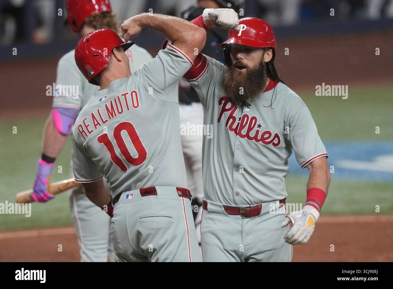 Philadelphia Phillies' J.T. Realmuto (10) and Brandon Marsh celebrates ...