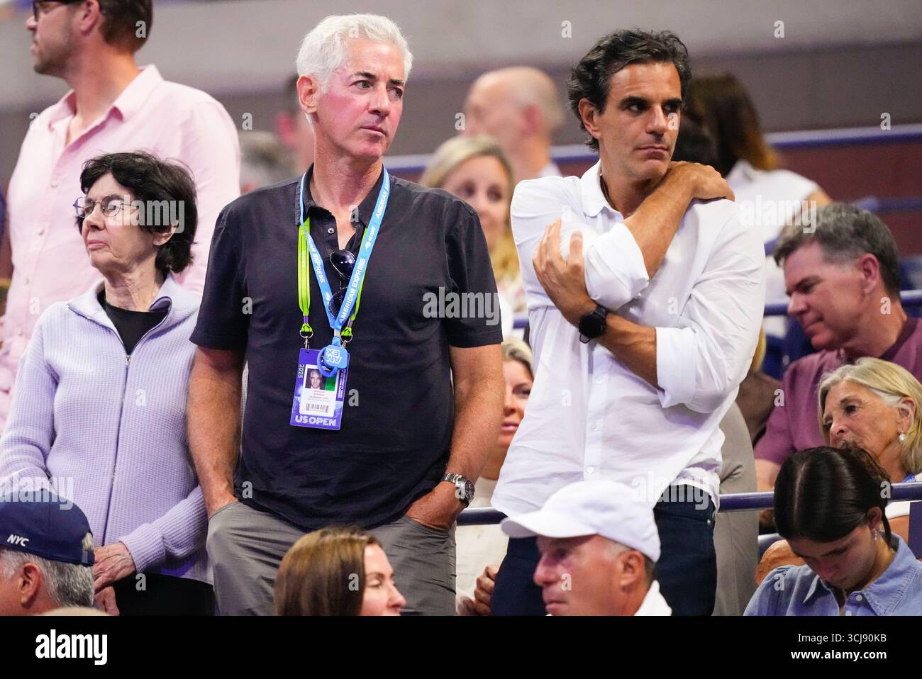 Bill Ackman, second from left, watches play between Felix Auger-Aliassime, of Canada, and Jannik ...